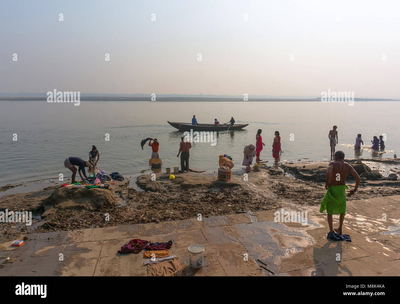 VARANASI, INDIA. February 28, 2017: Laundry in holy Ganges river. The ...