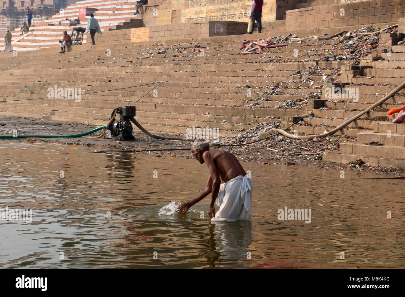 VARANASI, INDIA. February 28, 2017: Laundry in holy Ganges river. The ...