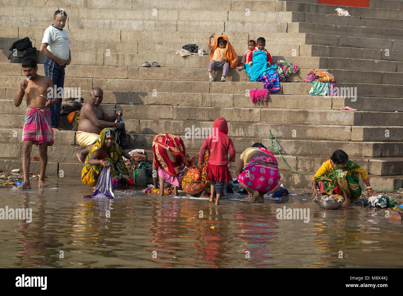 VARANASI, INDIA. February 28, 2017: Laundry in holy Ganges river. The ...