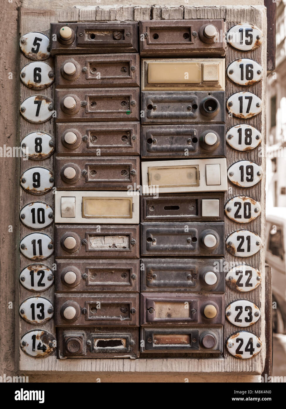 Doorbell panel in Valletta, Malta. 20 bell plates numbered from 5 to 24 ...