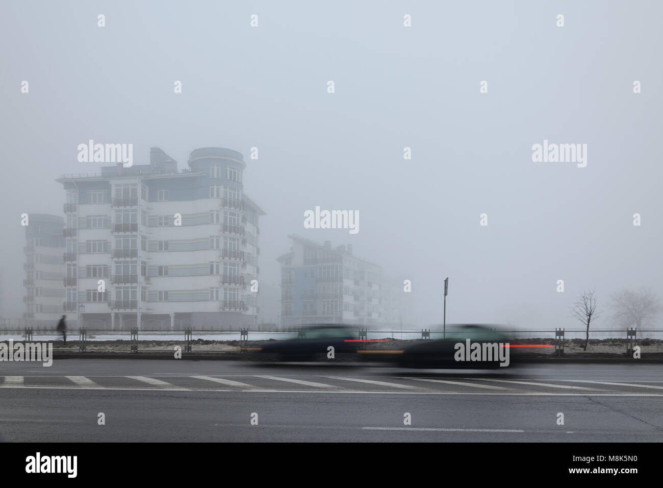 Mystical landscape of residential low-rise houses in dense fog Stock ...