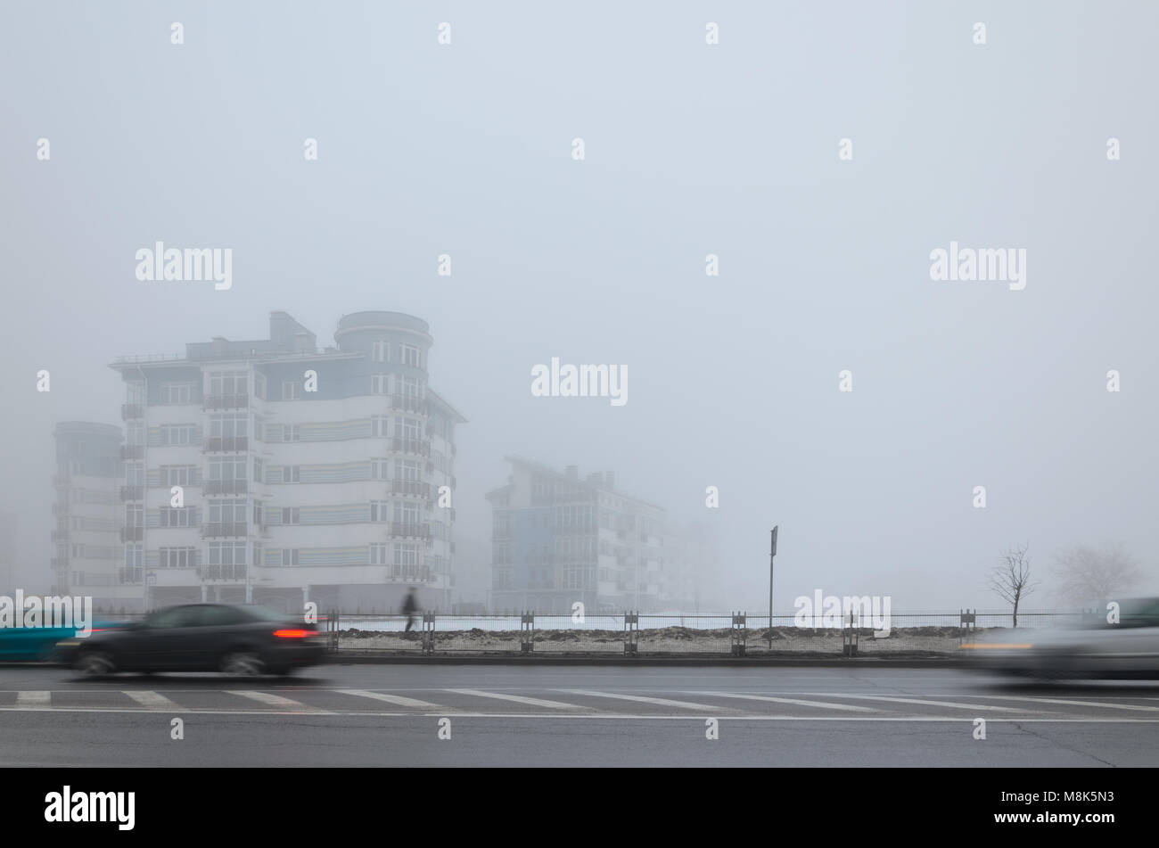 Mystical landscape of residential low-rise houses in dense fog Stock ...