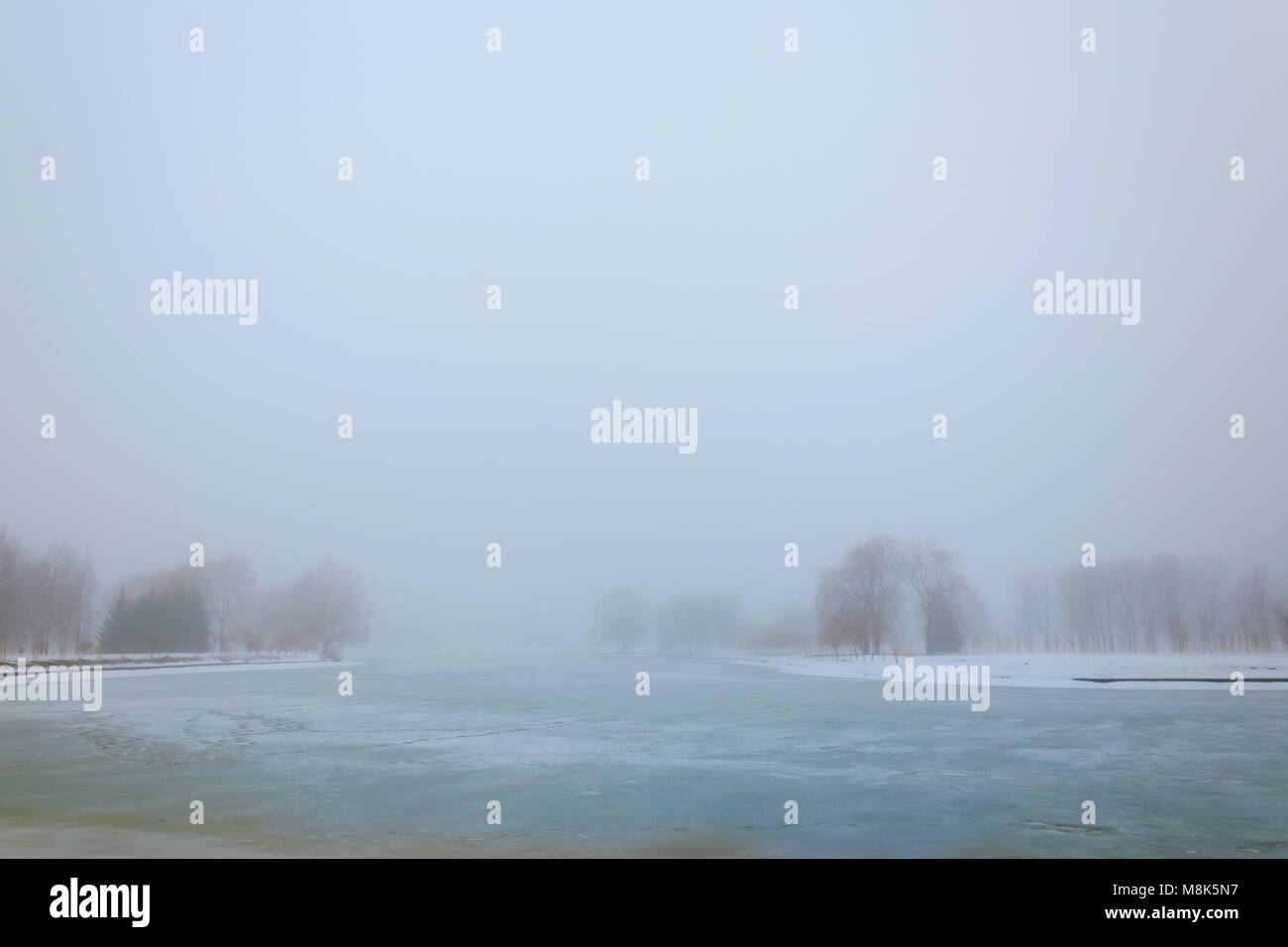 Lake or river at foggy winter mornind. Mystical desaturated landscape ...