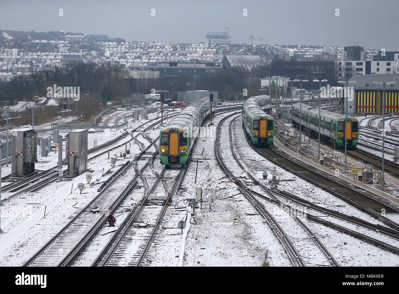 Trains pull out of Brighton station in the snow.18 Mar 2018. Picture by ...