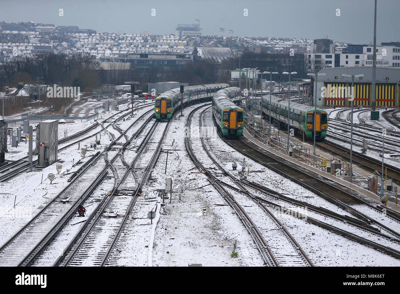 Trains pull out of Brighton station in the snow.18 Mar 2018. Picture by ...