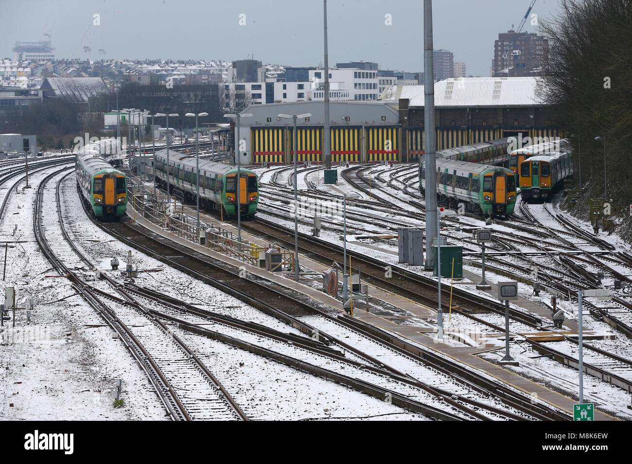 Trains pull out of Brighton station in the snow.18 Mar 2018. Picture by ...