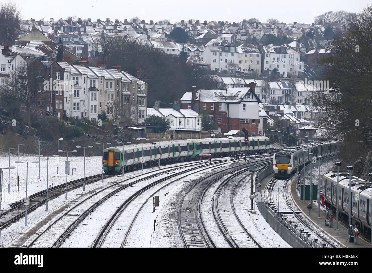 Trains pull out of Brighton station in the snow.18 Mar 2018. Picture by ...