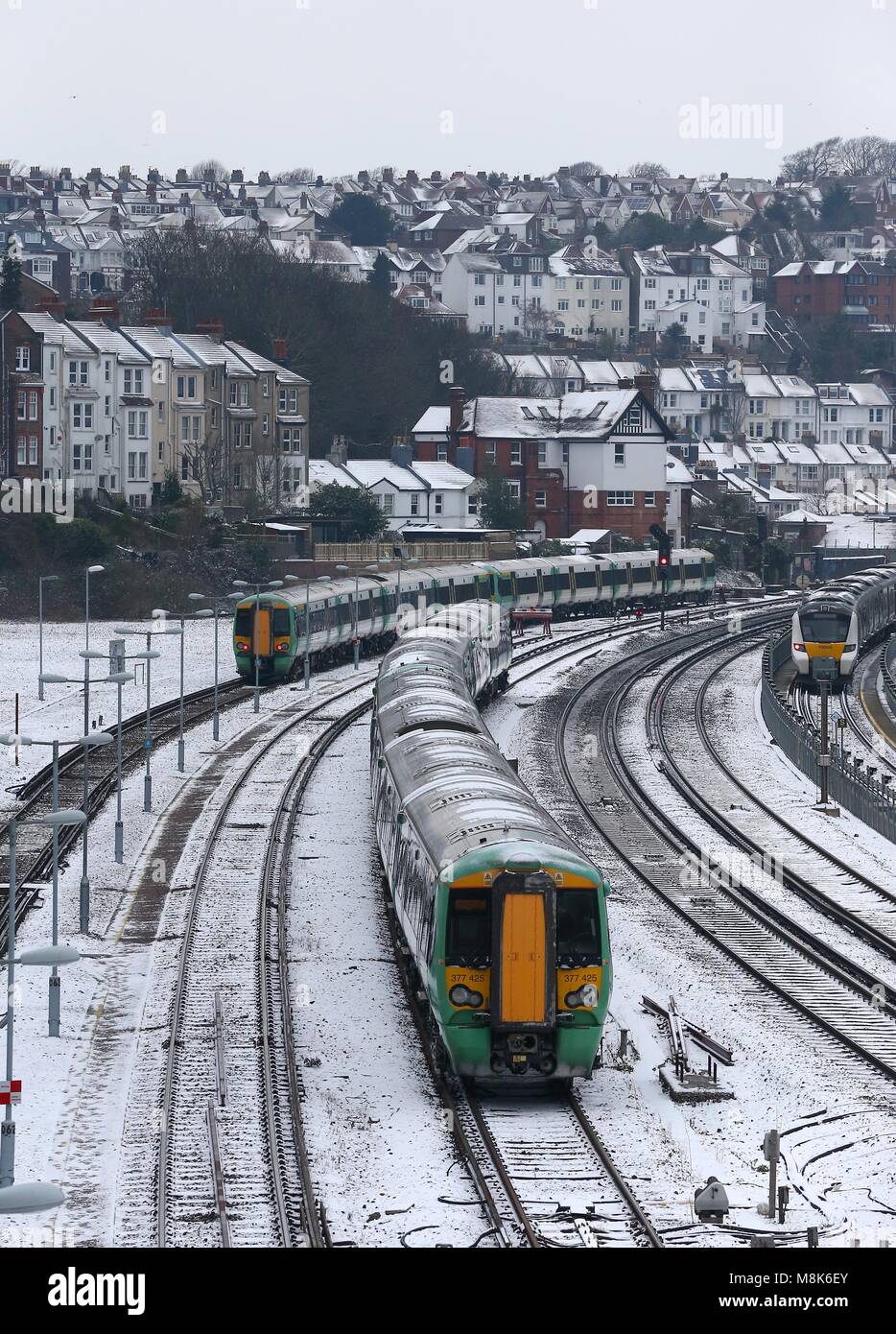 Trains pull out of Brighton station in the snow.18 Mar 2018. Picture by ...