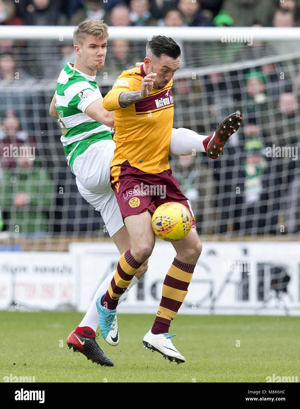 Celtic's Kristoffer Ajer and Motherwellss Ryan Bowman battle for the ...