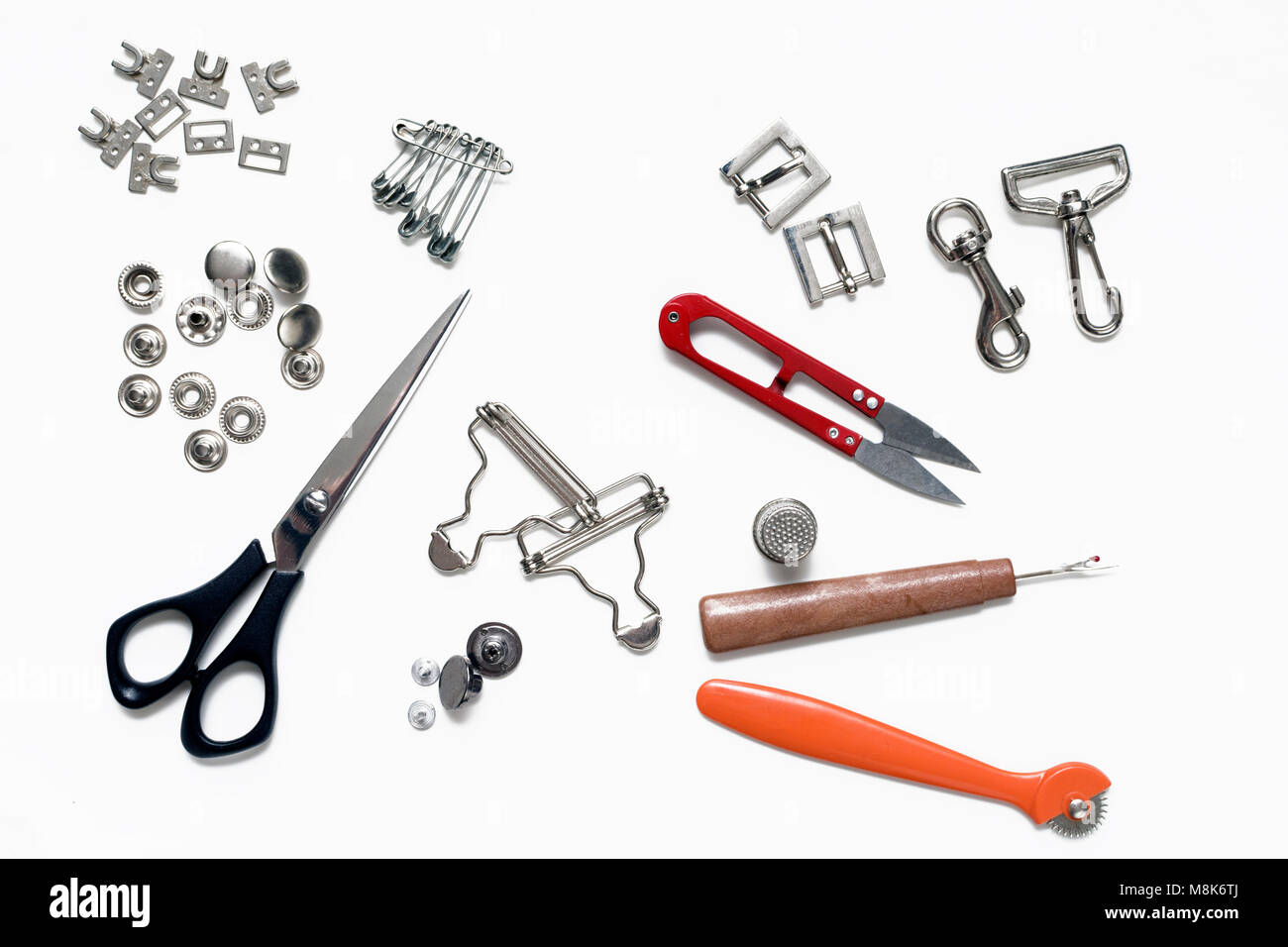 Belt buckles and rivets and metal sewing accessories Stock Photo - Alamy