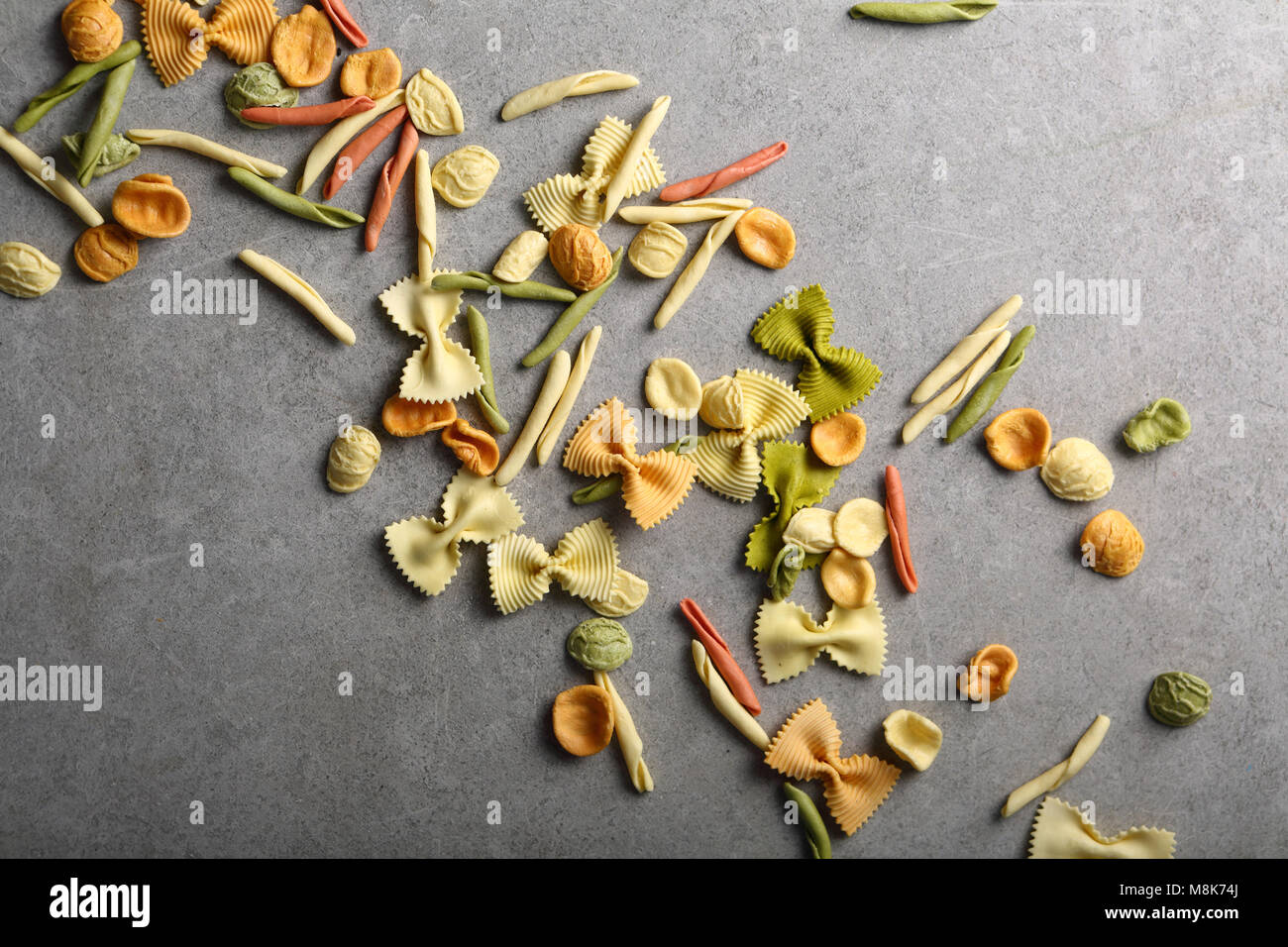 Gray pasta raw background Stock Photo - Alamy