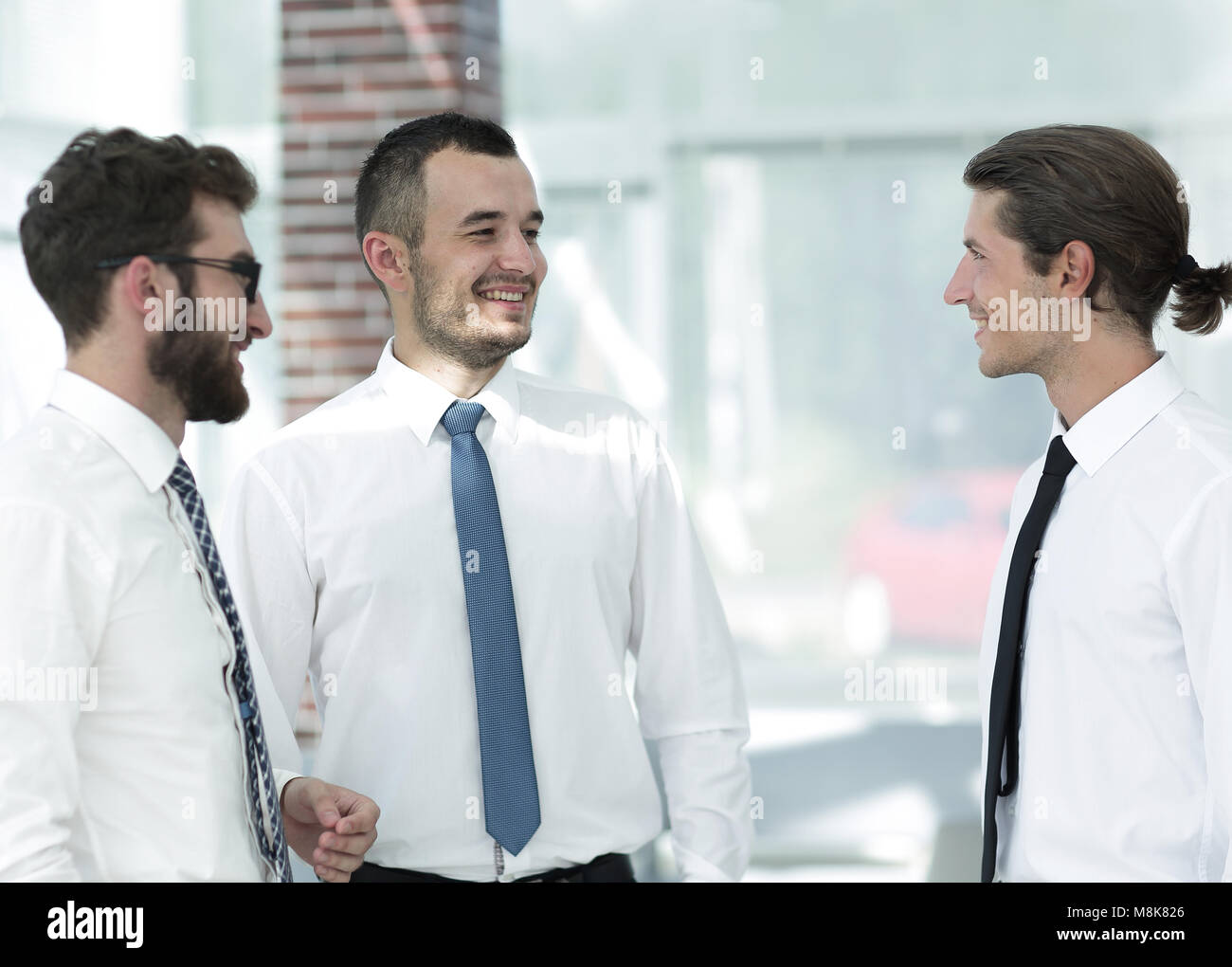 employees are talking ,standing in the office Stock Photo - Alamy