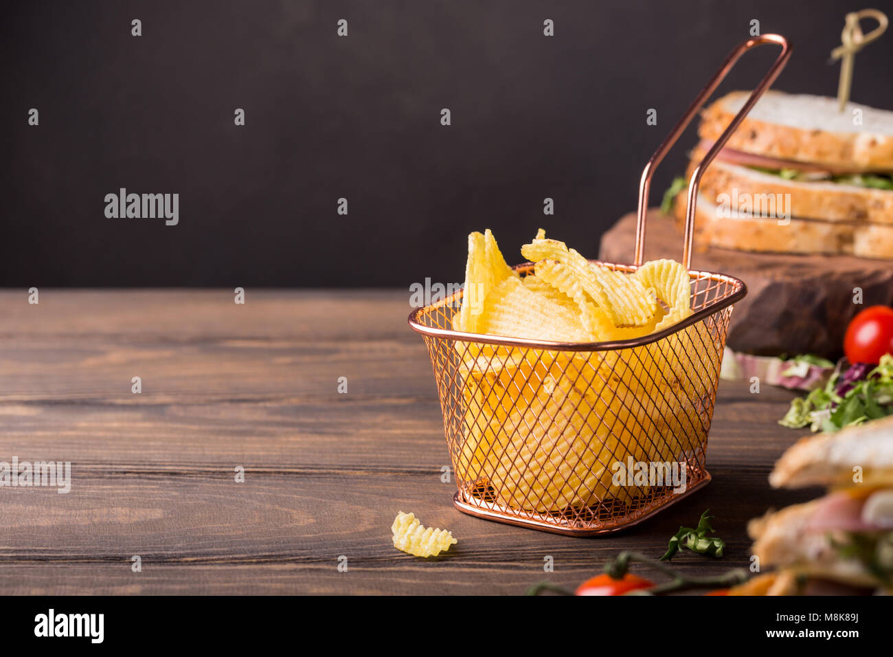 Crispy potato chips in copper basket Stock Photo - Alamy