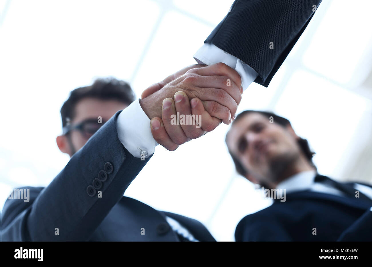 Cropped image of business people shaking hands Stock Photo - Alamy