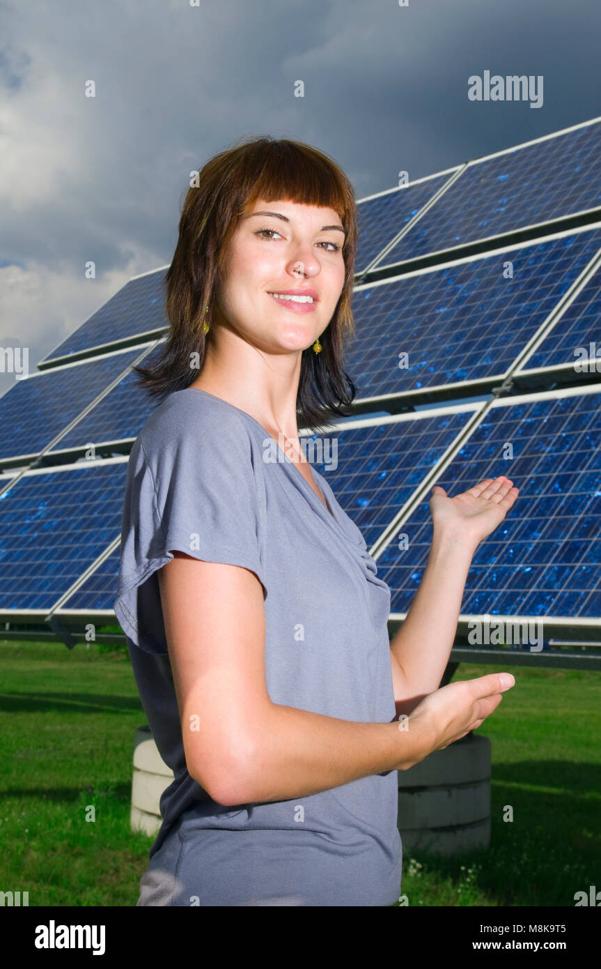 Side Torso View Of A Young Woman With Hands On A Photovoltaic Panels ...
