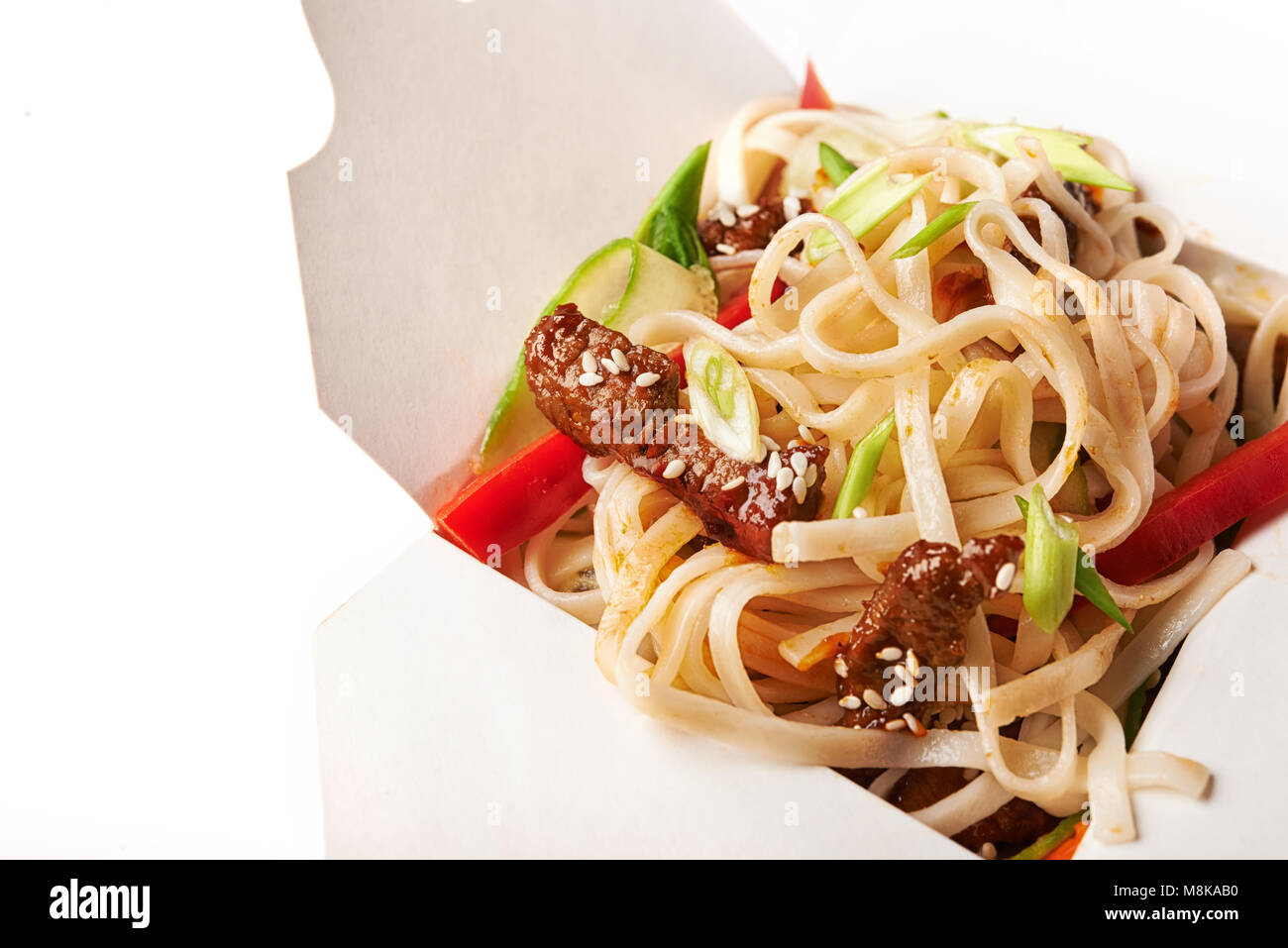 asian delivery food. noodles with meat and vegetables Stock Photo - Alamy