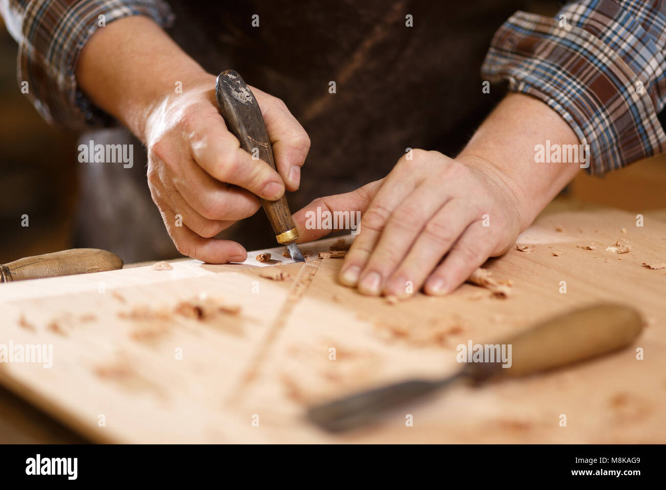 Carpenter with chisel in the hands on the workbench. Vintage Stock ...