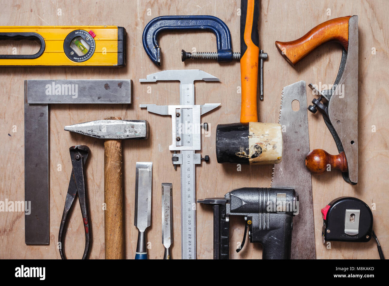Composition of carpenter tools on wood table background Stock Photo - Alamy