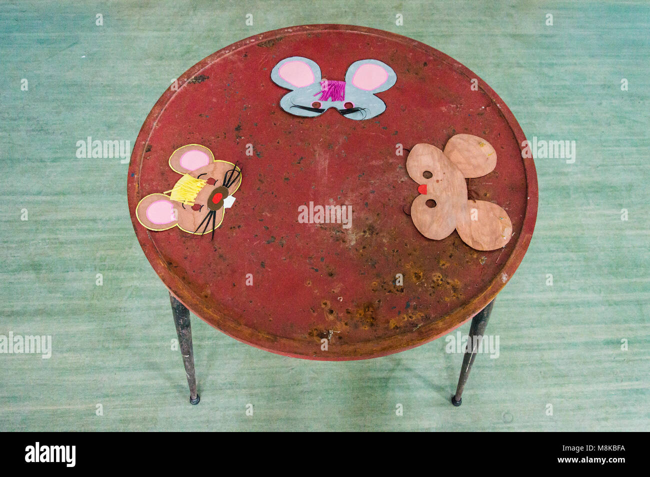 Red old round table with three paper hand drawn mice Stock Photo - Alamy