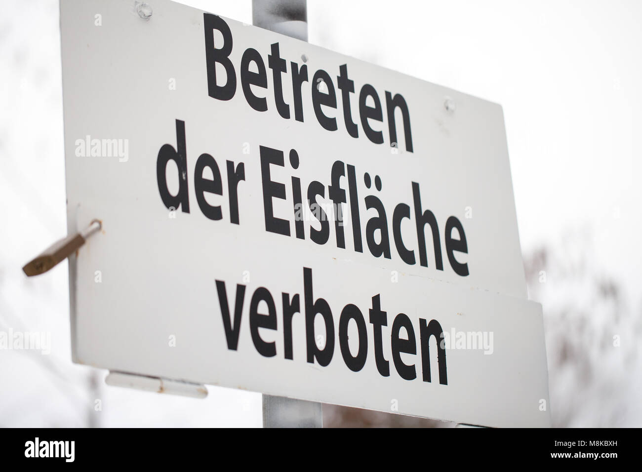German warning sign on a lake. It means: Enter the ice surface ...