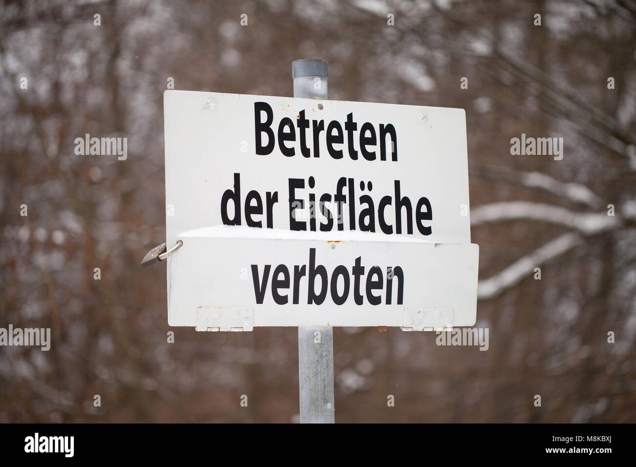 German warning sign on a lake. It means: Enter the ice surface ...