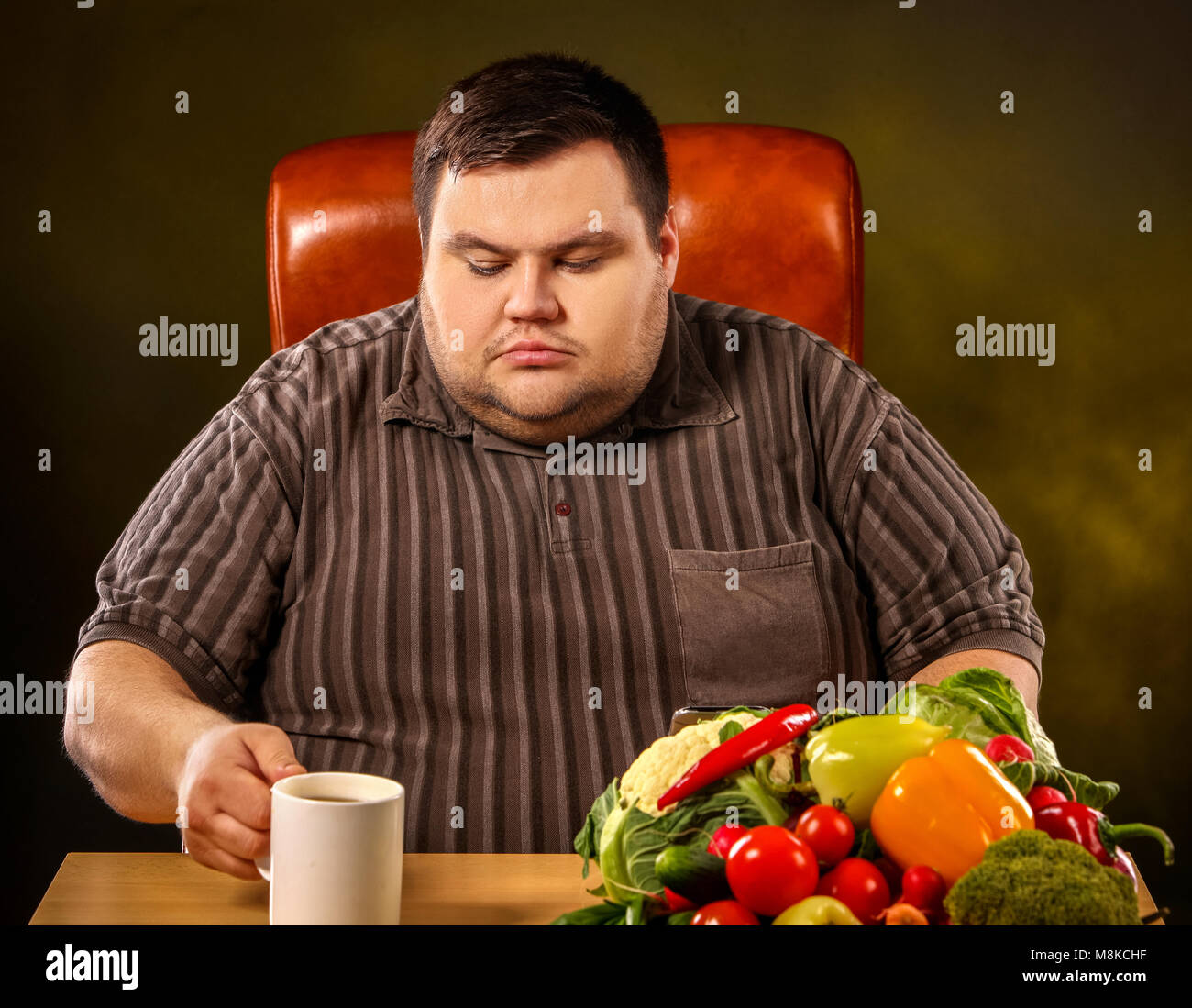 Diet fat man eating healthy food . Healthy slimming tea Stock Photo - Alamy