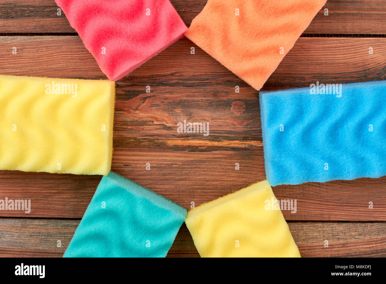 Colorful kitchen sponges, copy space Stock Photo - Alamy