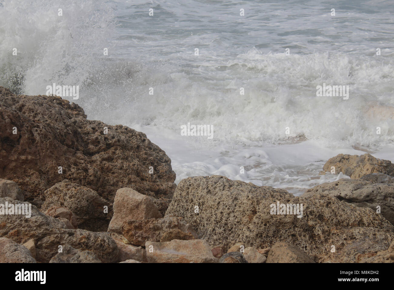 Waves splash, rocks Stock Photo - Alamy