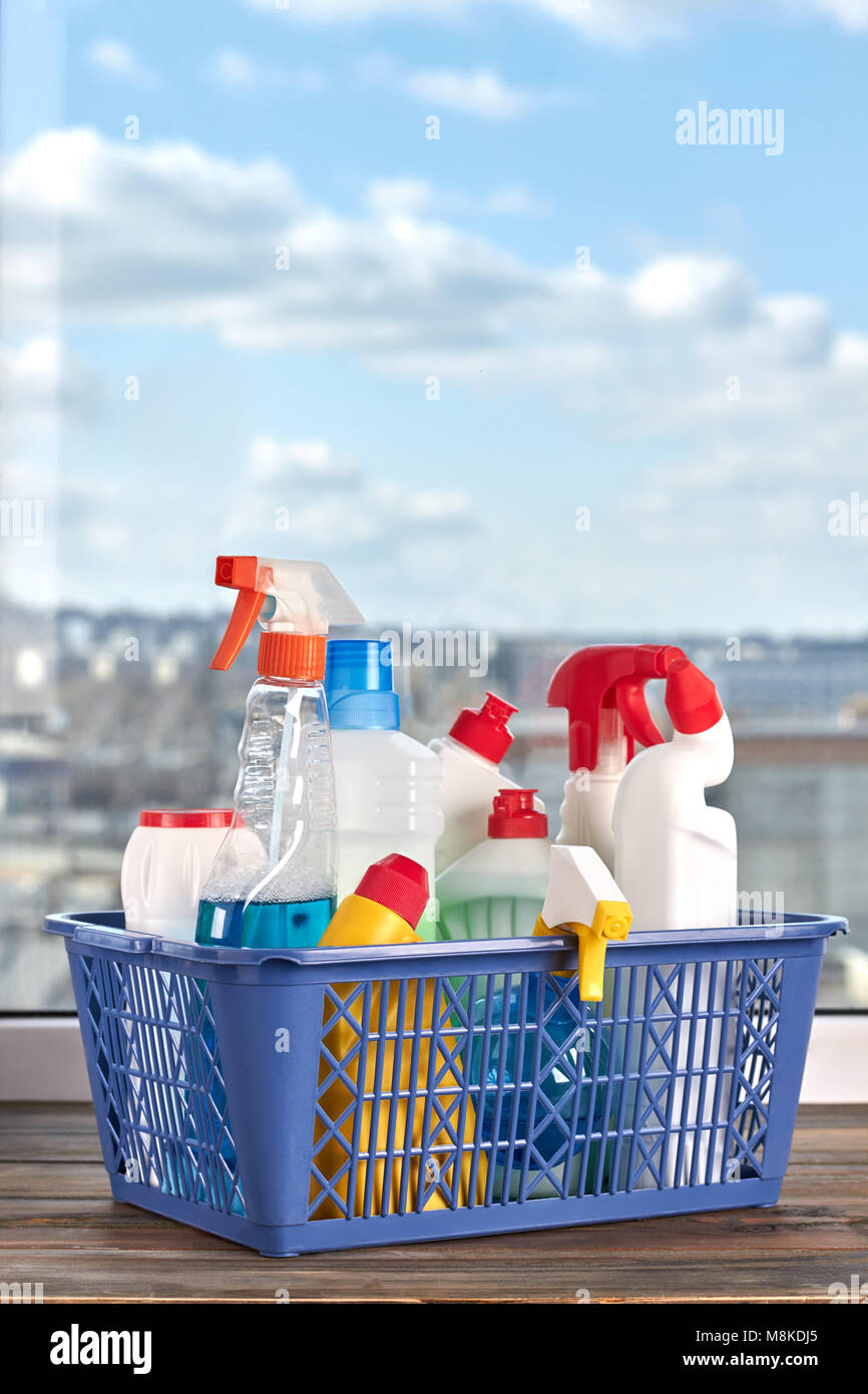 Basket with cleaning supplies Stock Photo - Alamy