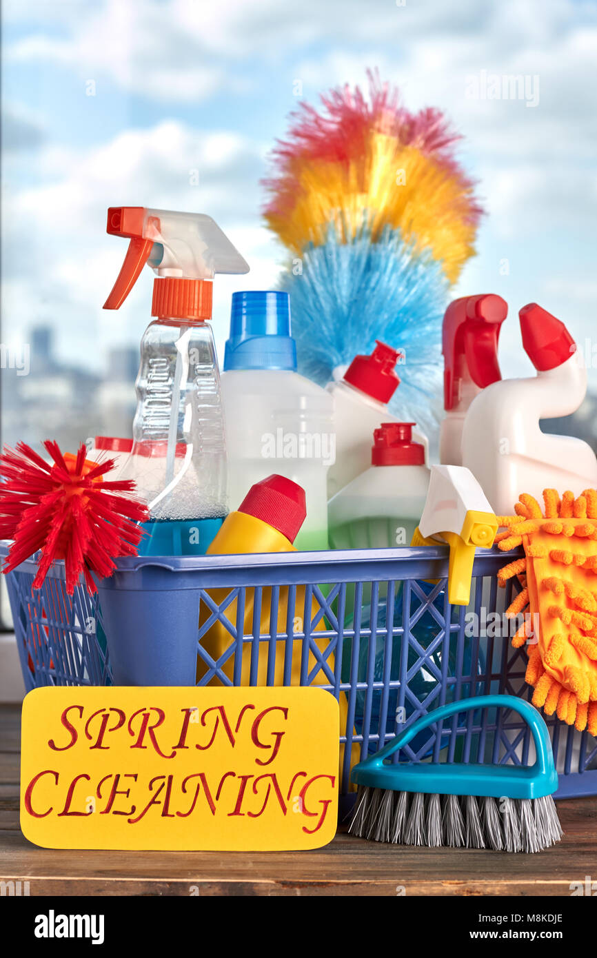 Colorful cleaning items in basket Stock Photo - Alamy