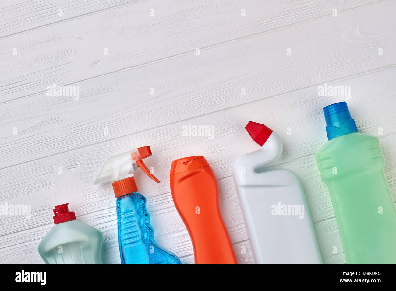 Collection of containers with liquid for cleaning Stock Photo - Alamy