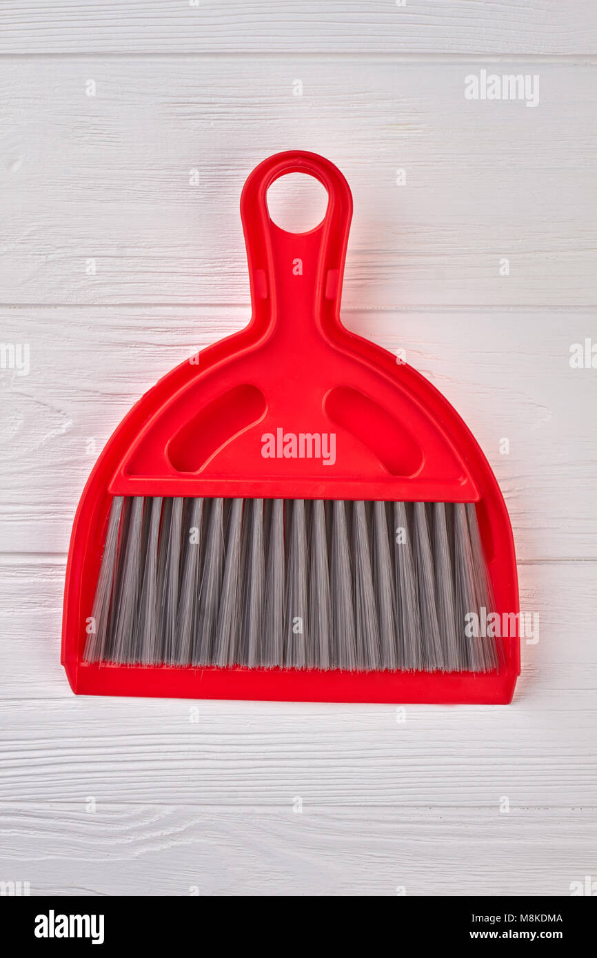 Red scoop and brush, top view Stock Photo - Alamy