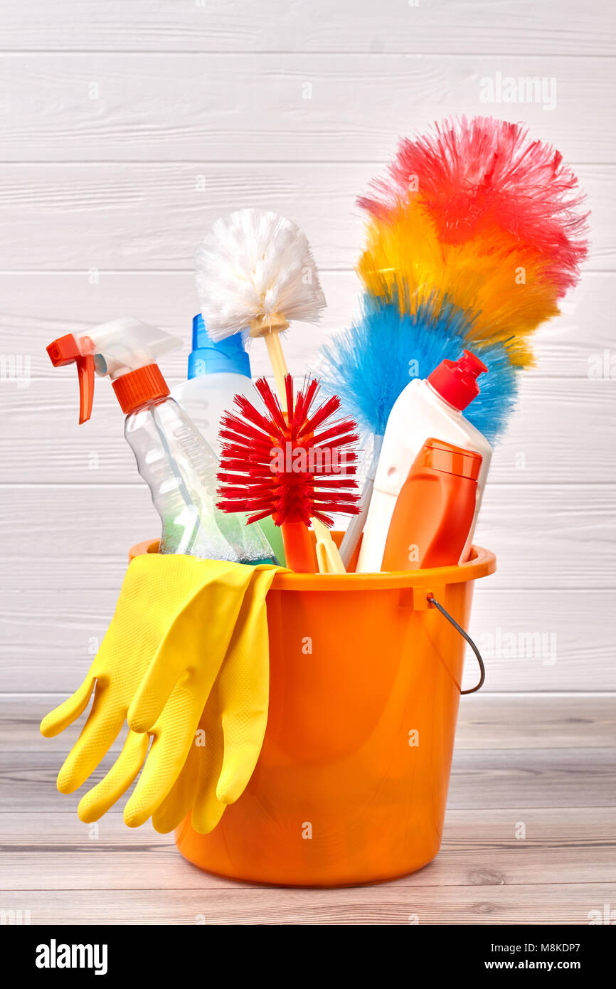 Set of cleaning supplies in colorful bucket Stock Photo - Alamy