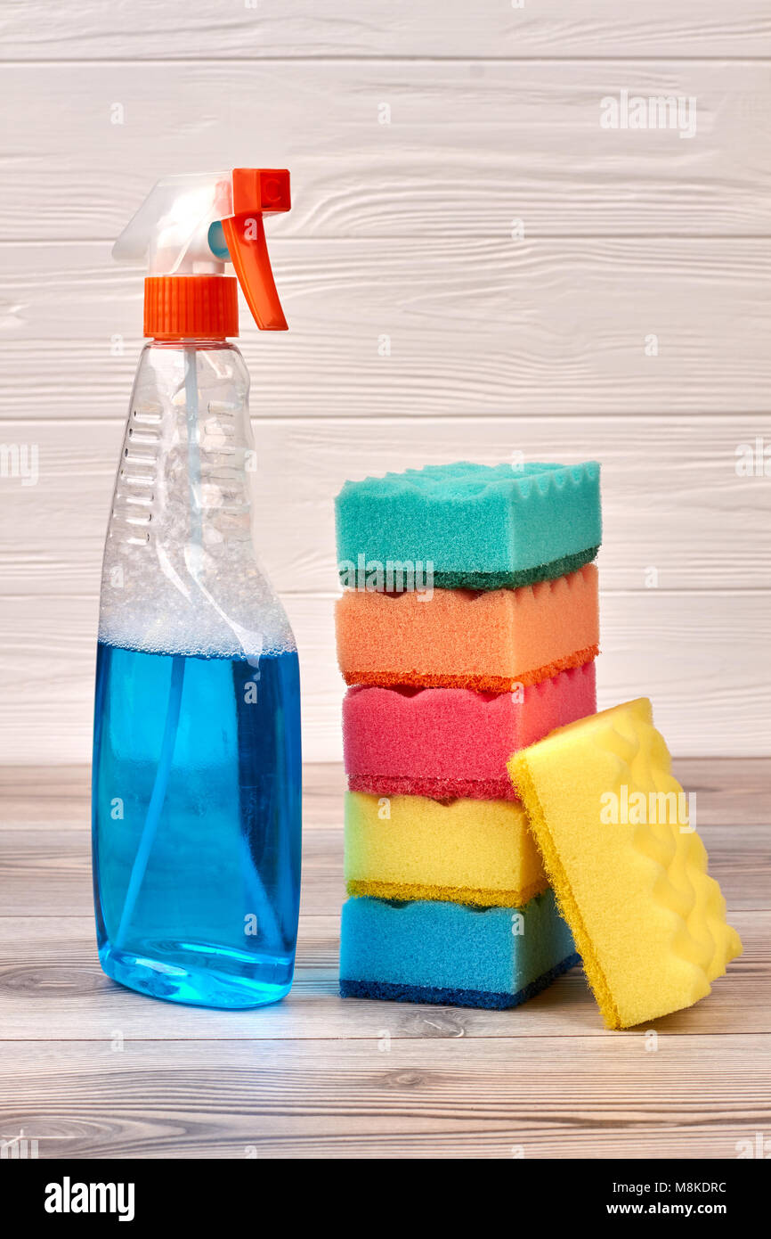 Cleaning sponges and plastic bottle of spray Stock Photo - Alamy