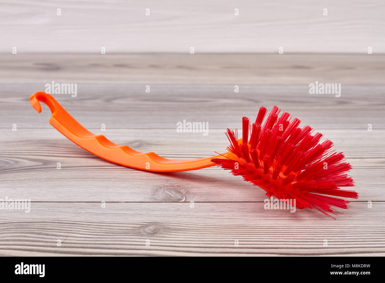 Red brush for washing dishes Stock Photo - Alamy
