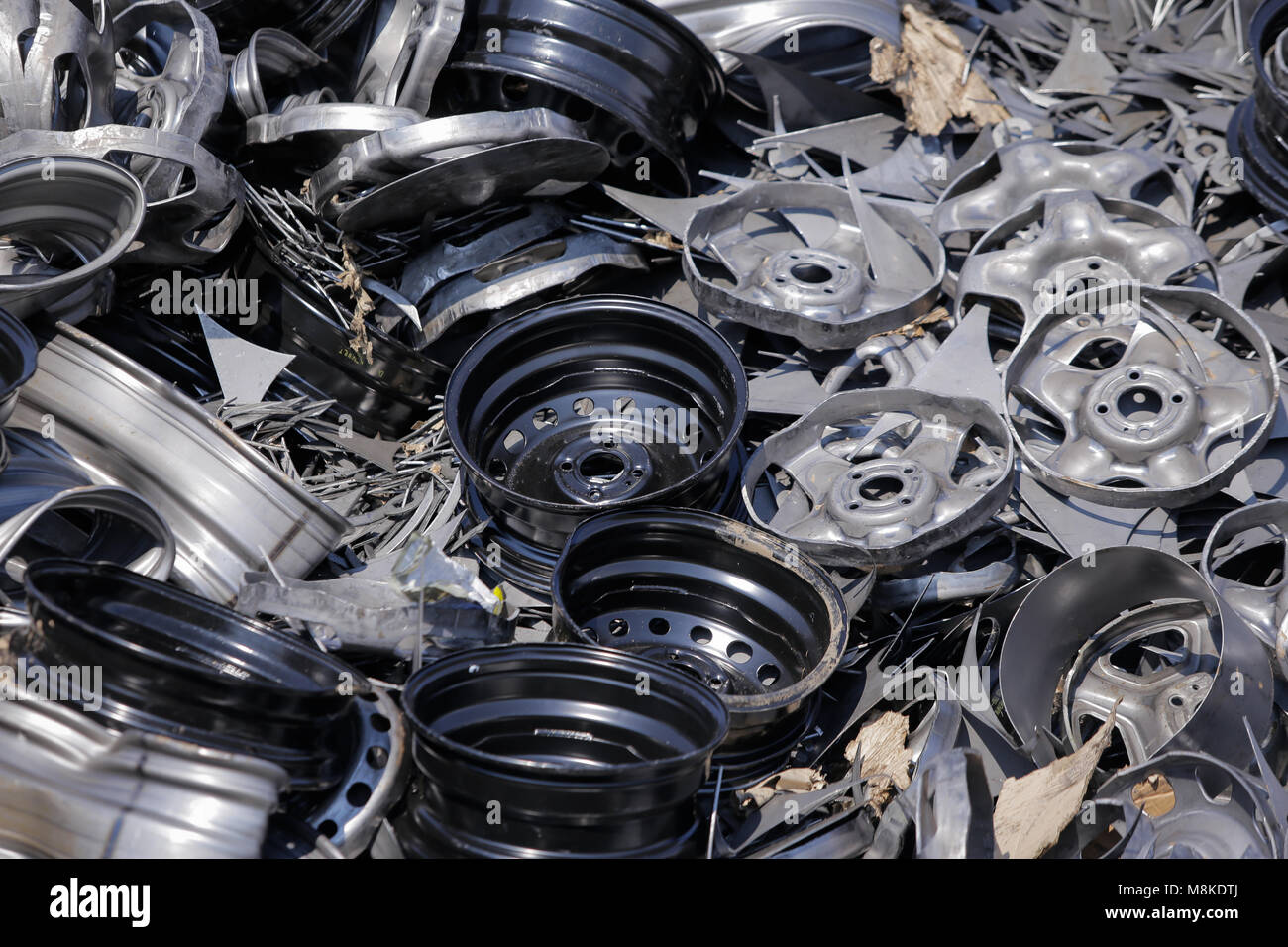 Old car rims at a scrapheap junkyard Stock Photo - Alamy