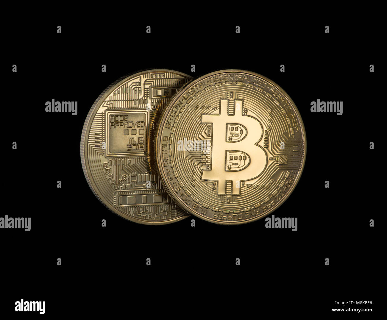 two Golden bitcoins on a black background. electronic money isolated ...