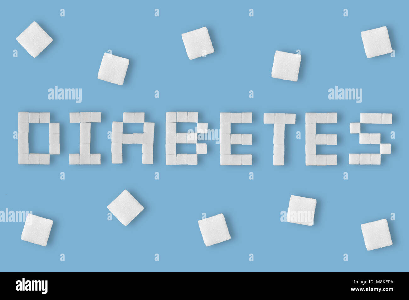 Word Diabetes written with sugar cubes on blue background Stock Photo ...