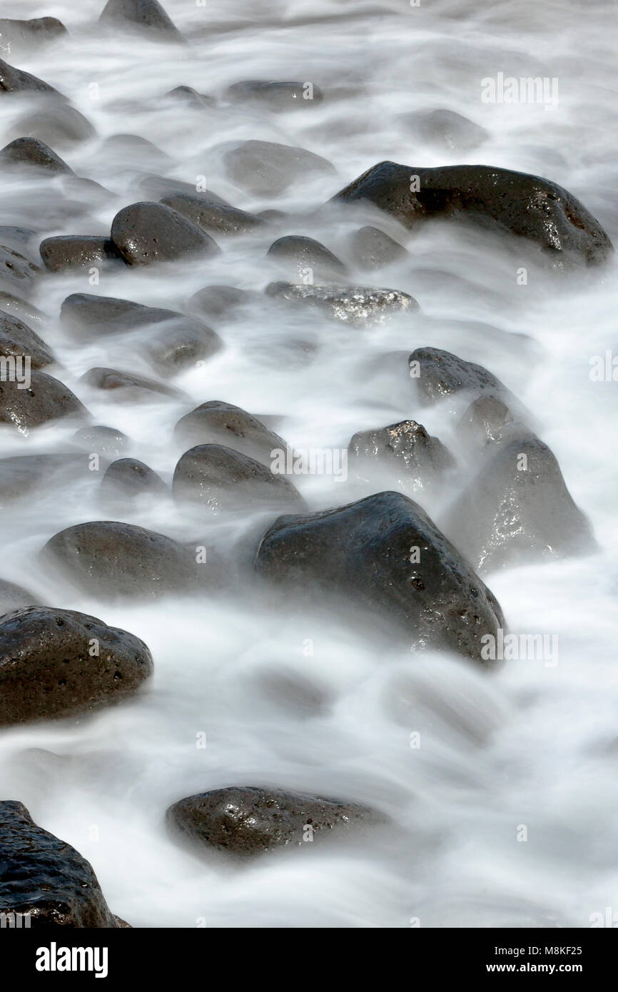 water streaming on the seaside Stock Photo - Alamy