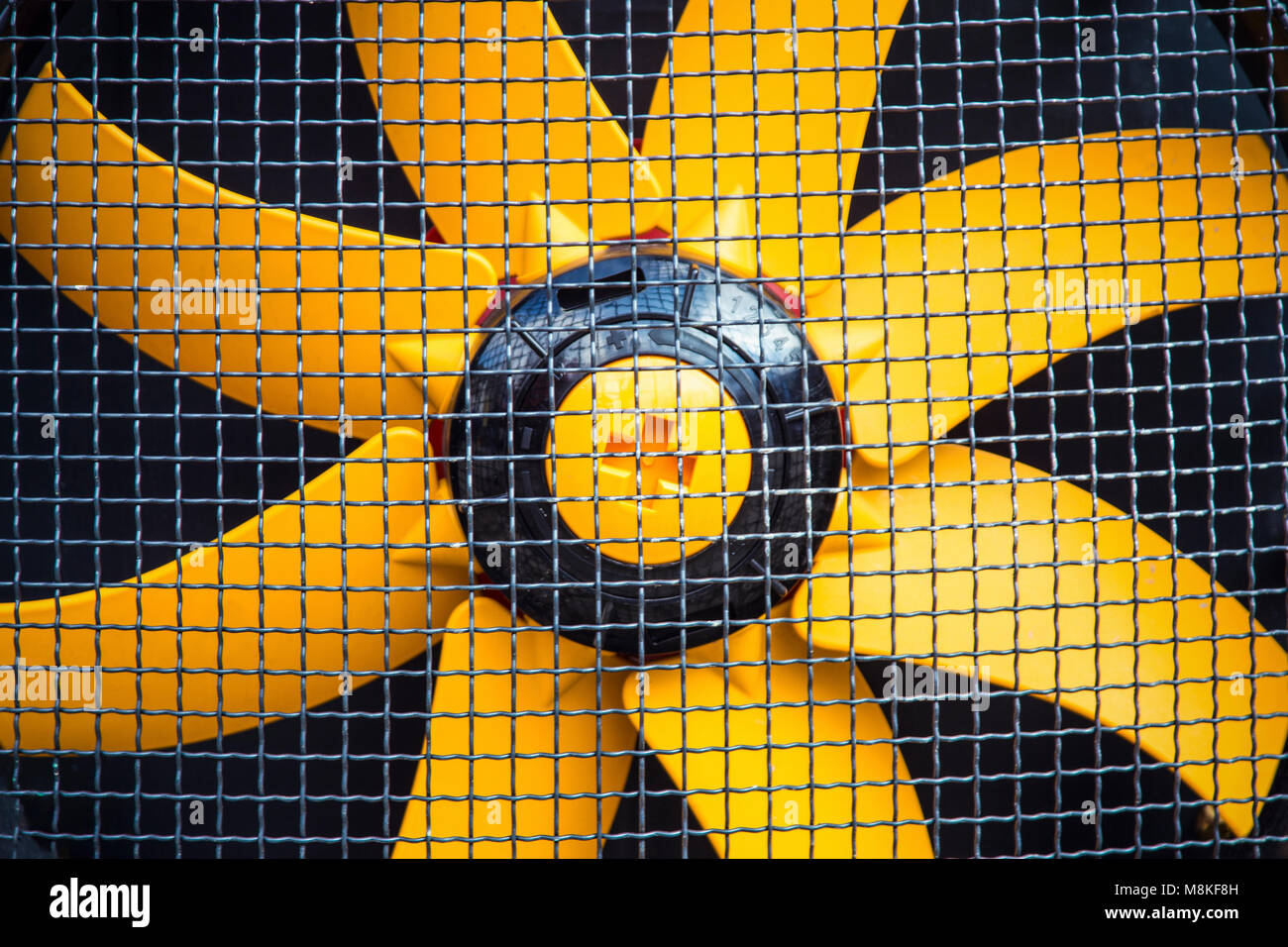 yellow fan near the tractor, close-up, background image Stock Photo - Alamy