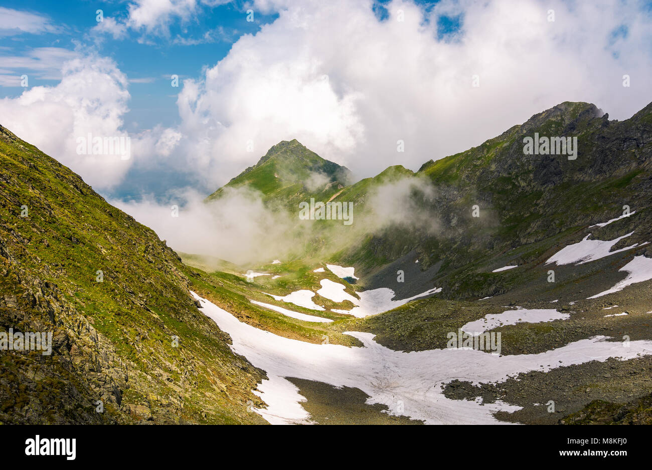 mountain ridge among the clouds. beautiful summer landscape with peak ...