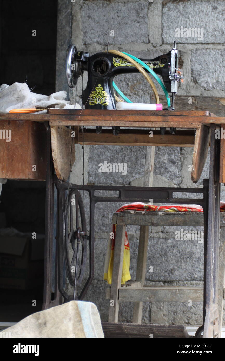 Old sewing machine outside a house Stock Photo - Alamy