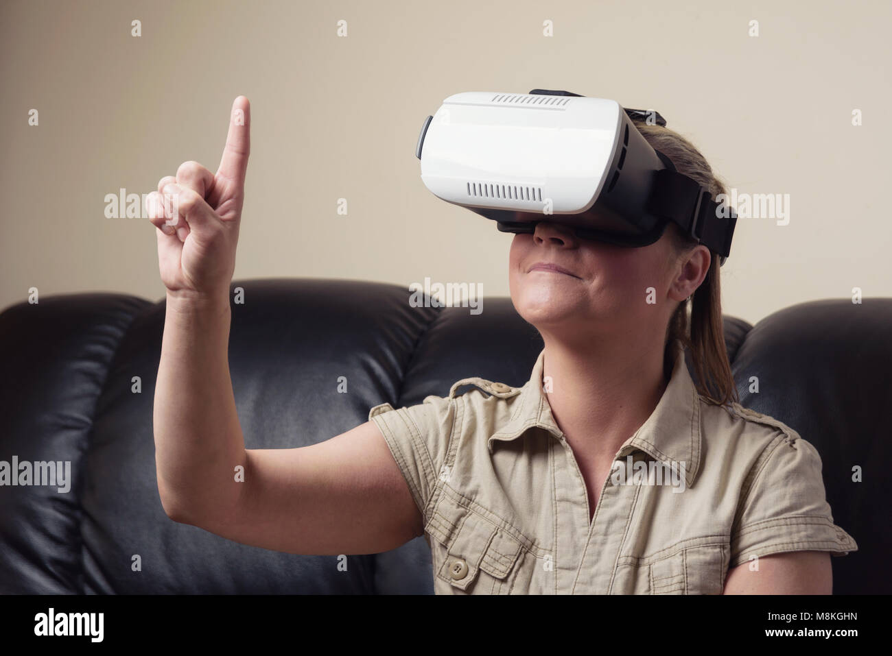 Woman wearing virtual reality glasses Stock Photo - Alamy