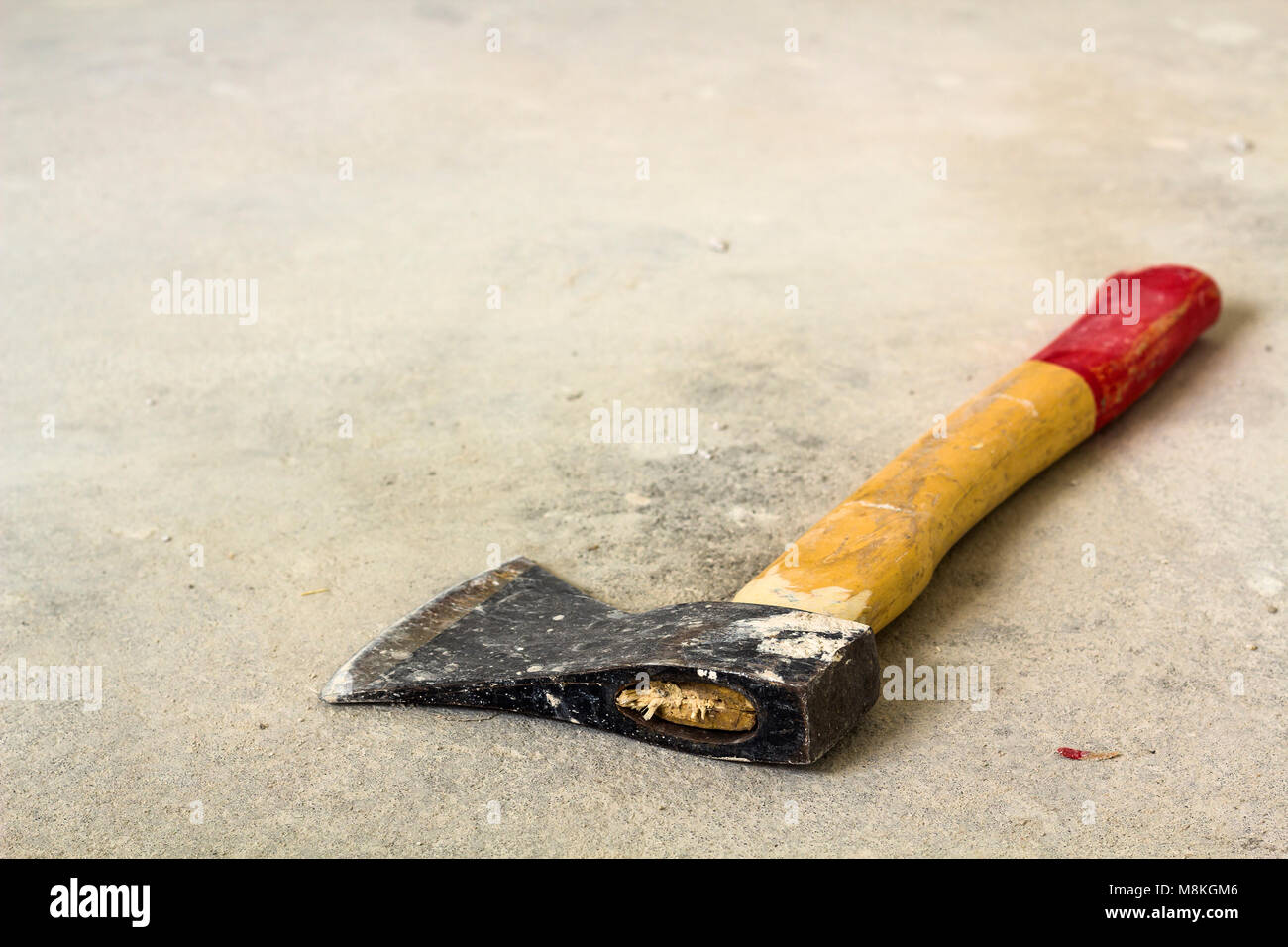 Old iron axe with wooden red and yellow handle isolated on white ...
