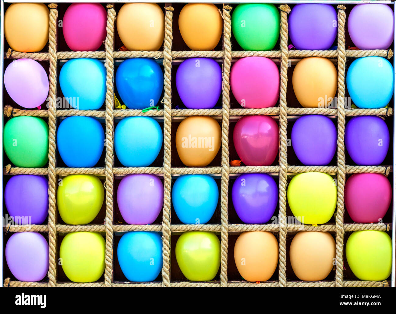 Many colorful air baloons in separate boxes Stock Photo - Alamy