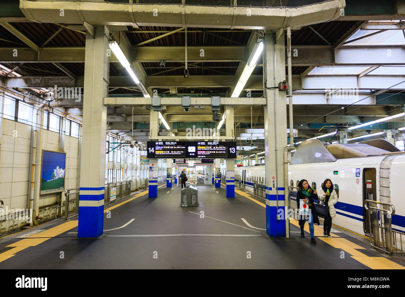 Japan, Hiroshima station. View along middle of platform with shinkansen ...