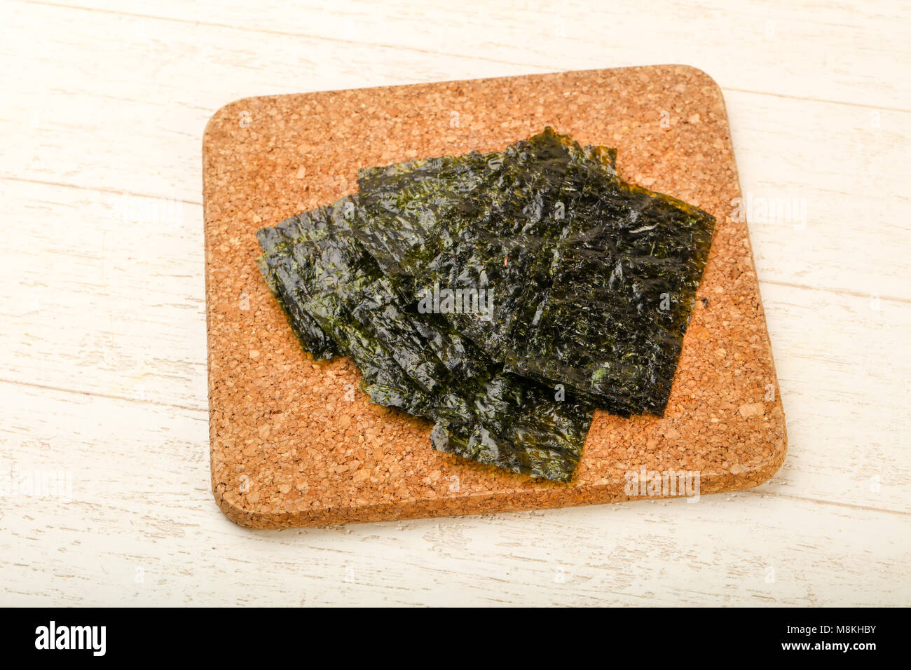 Crispy Nori sheets chips over wooden background Stock Photo - Alamy