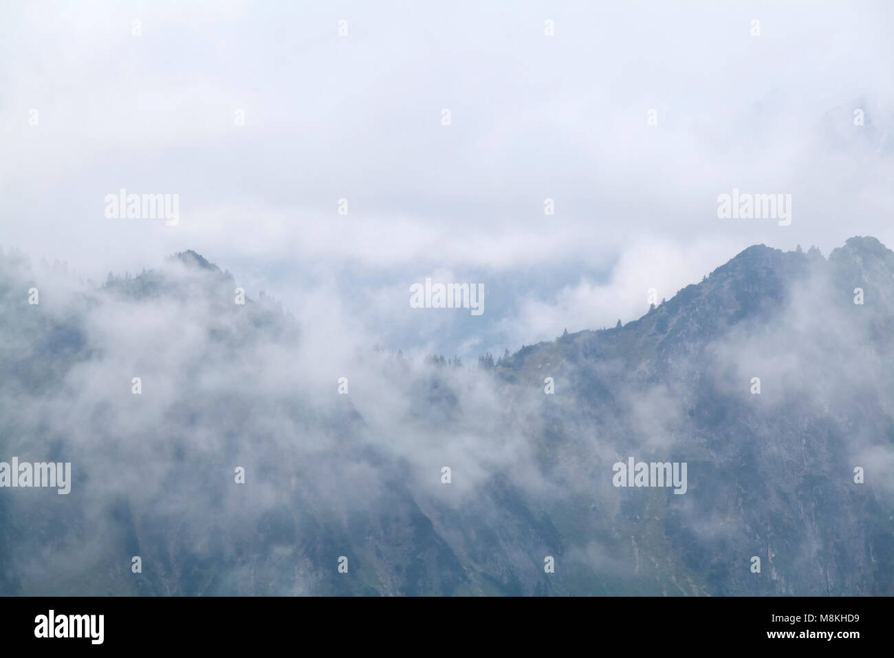 mountains in dense fog Stock Photo - Alamy
