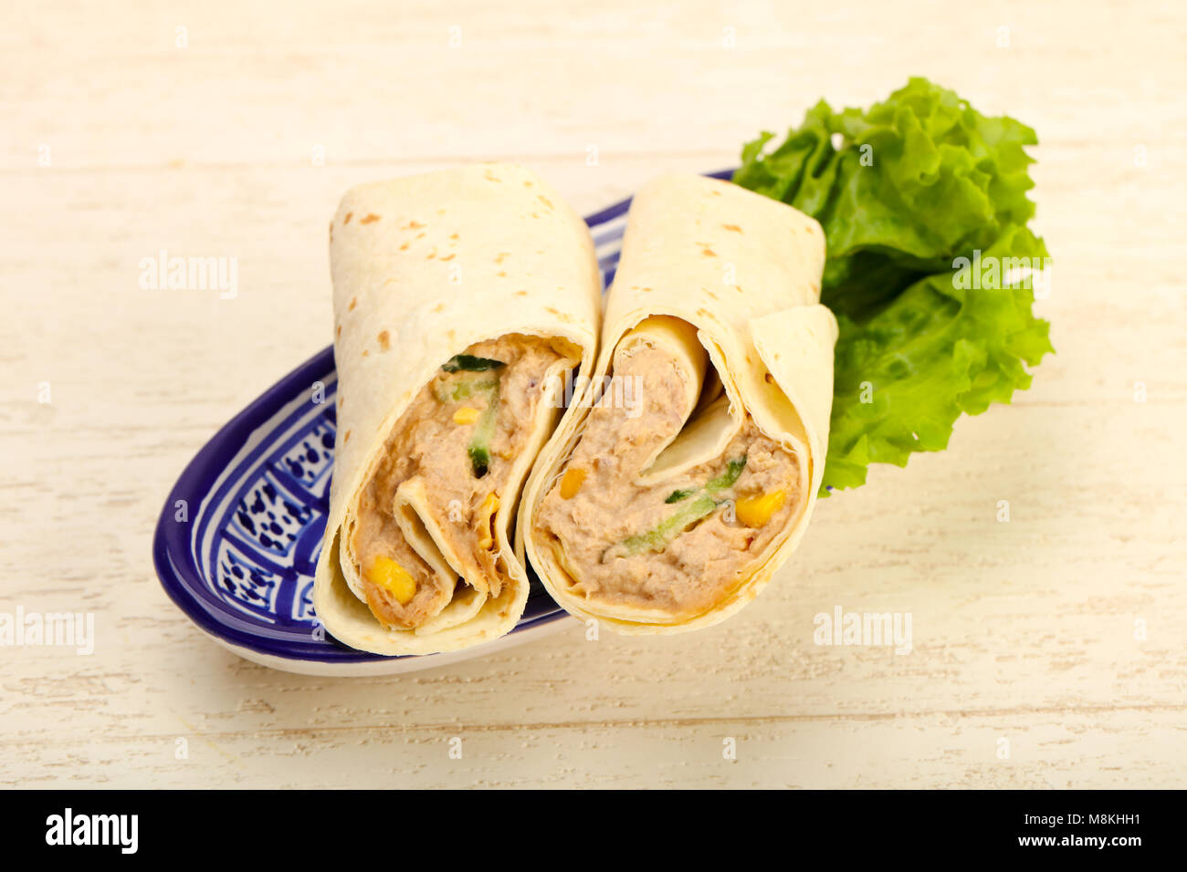 Tuna bread roll with salad leaves Stock Photo - Alamy