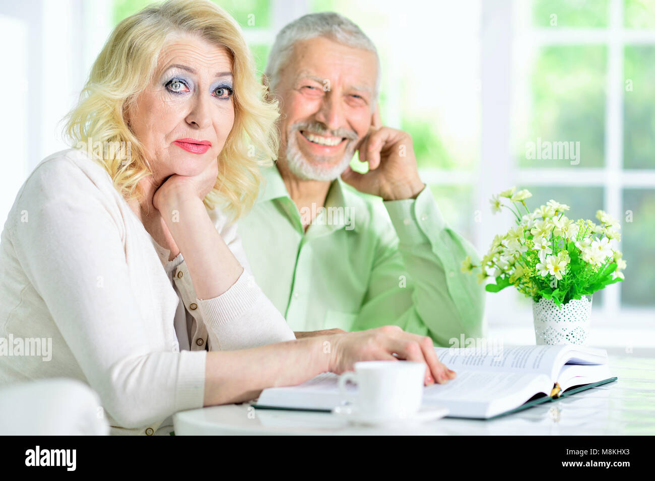 senior people reading book Stock Photo - Alamy